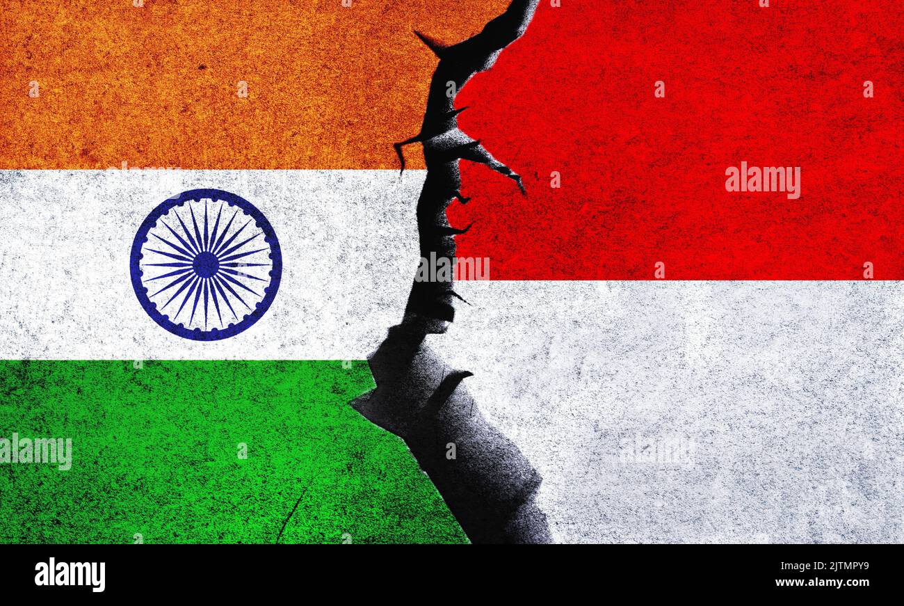 Indonesia vs India flags on a wall with a crack. India and Indonesia ...