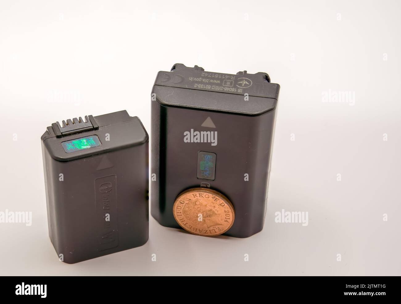 close-up of two different size Sony digital camera lithium ion ...