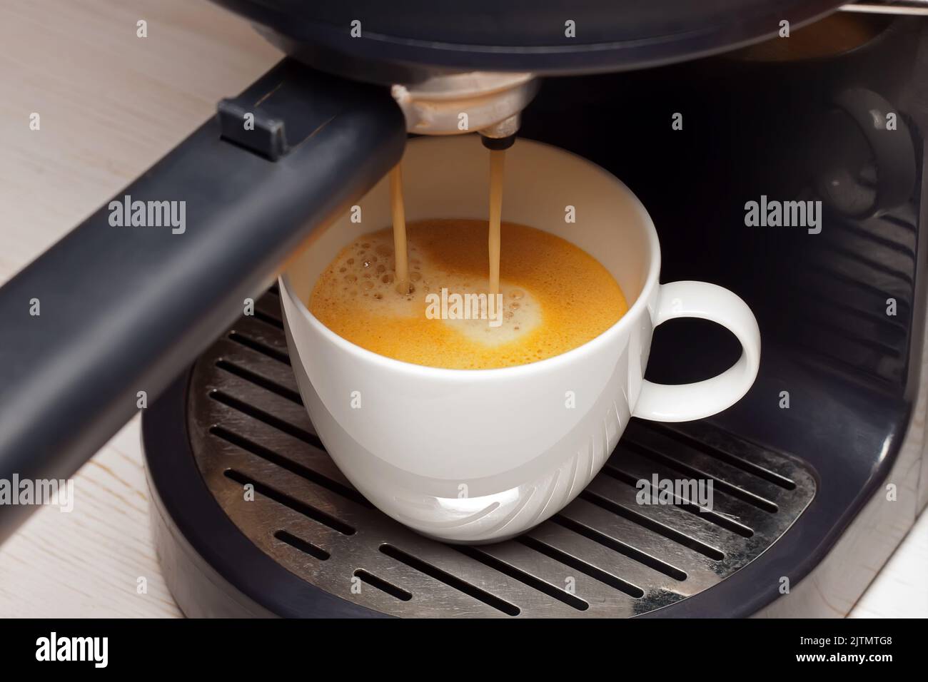 Coffee machine with white cup with fresh espresso. Process of making ...