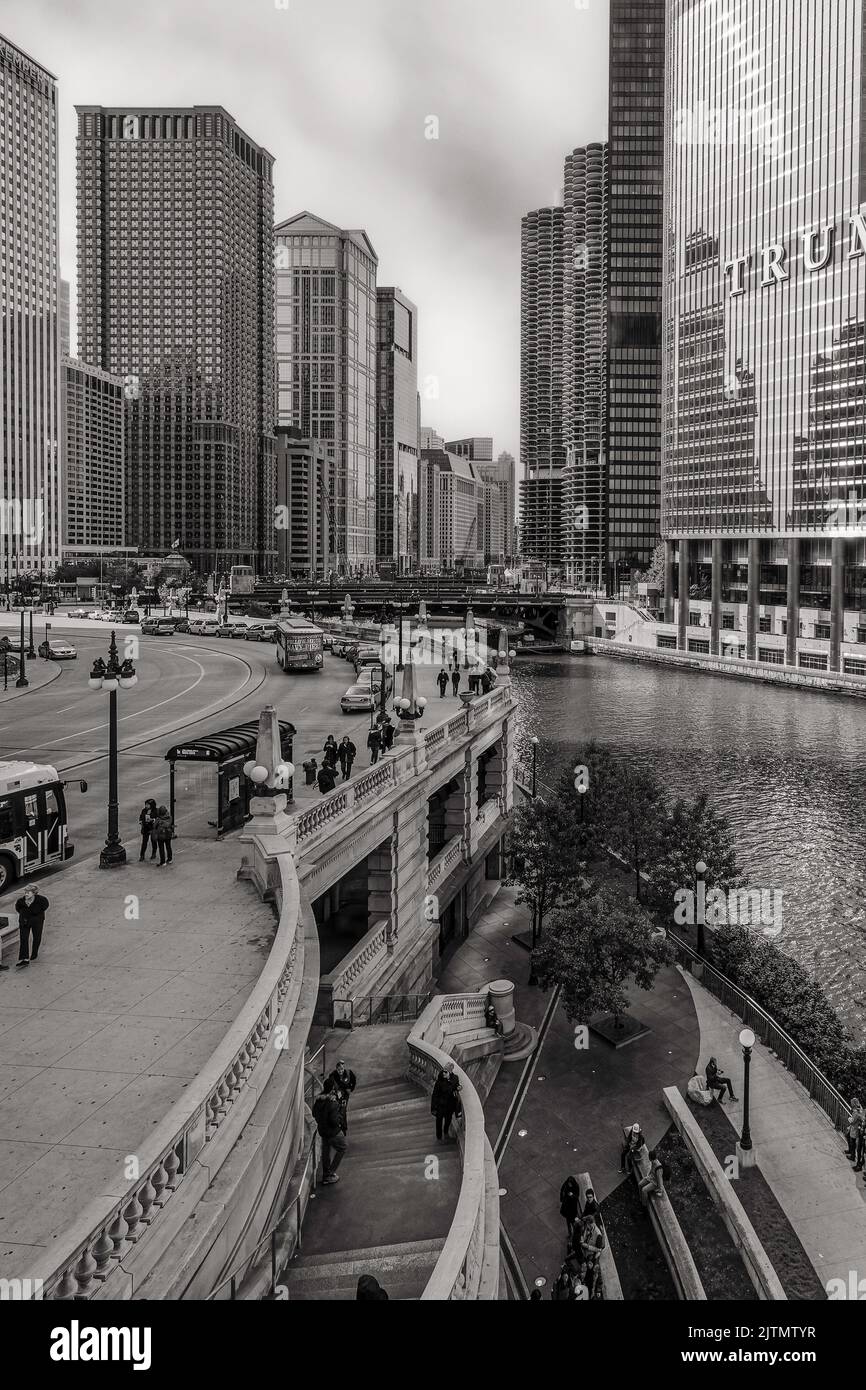 Street scene of the riverwalk along the Chicago River highlighting the ...