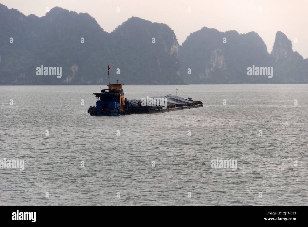 Shipping in Halong Bay, Vietnam. Self-propelled barges (medium landing ...