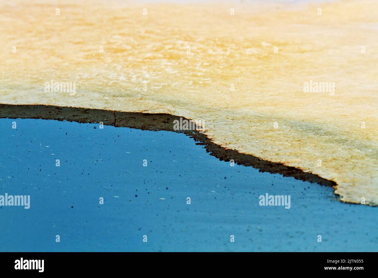 Water opening (edge of polynya), round thawing hole in ice among the ...