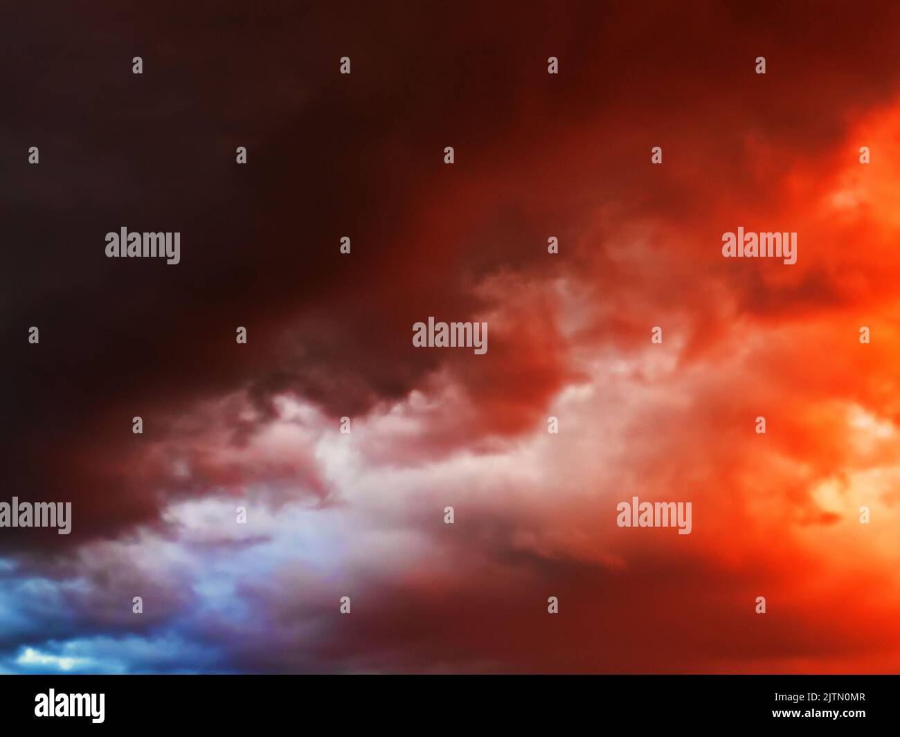 Shift of wind, ragged clouds. Sunset sky colors Stock Photo - Alamy