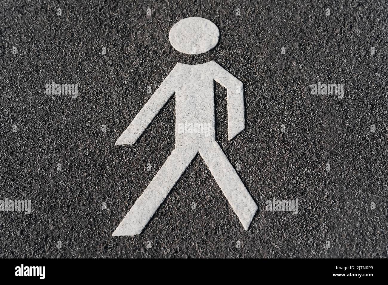 Pedestrian walker sign marking on asphalt street walkway foot walk way ...