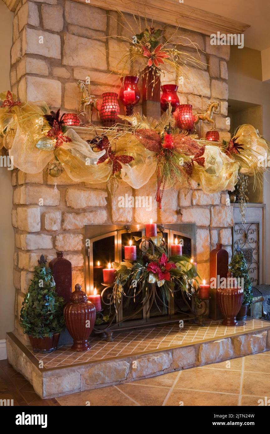 Fireplace mantle with illuminated Christmas decorations Stock Photo - Alamy