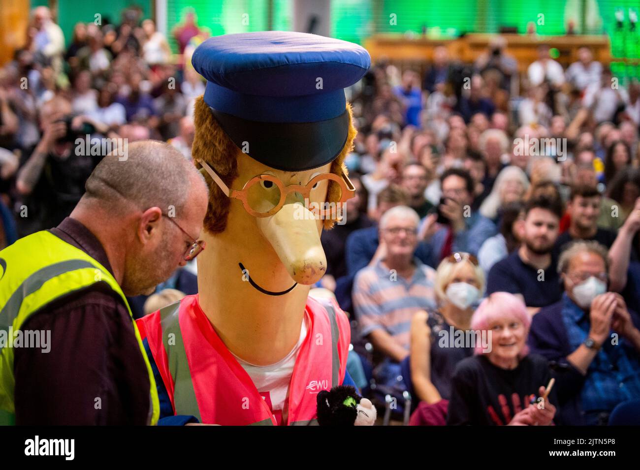 London, UK. 31 August 2022. A person in a Postman Pat costume arrives ...