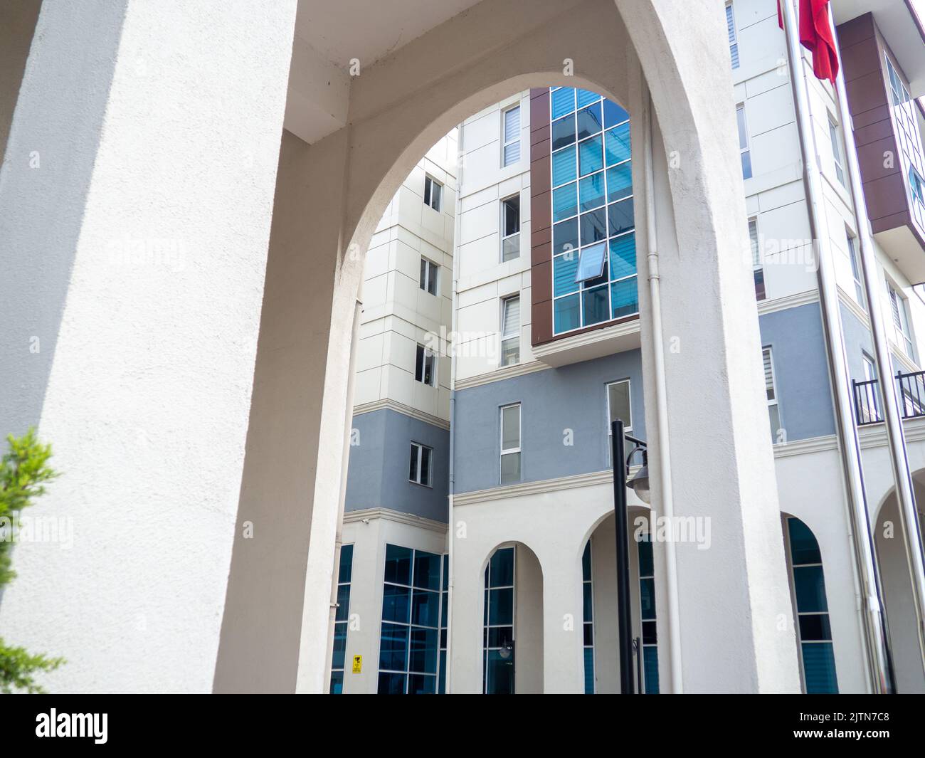 Arch and glazed windows. Modern urban architecture. Office house. High ...