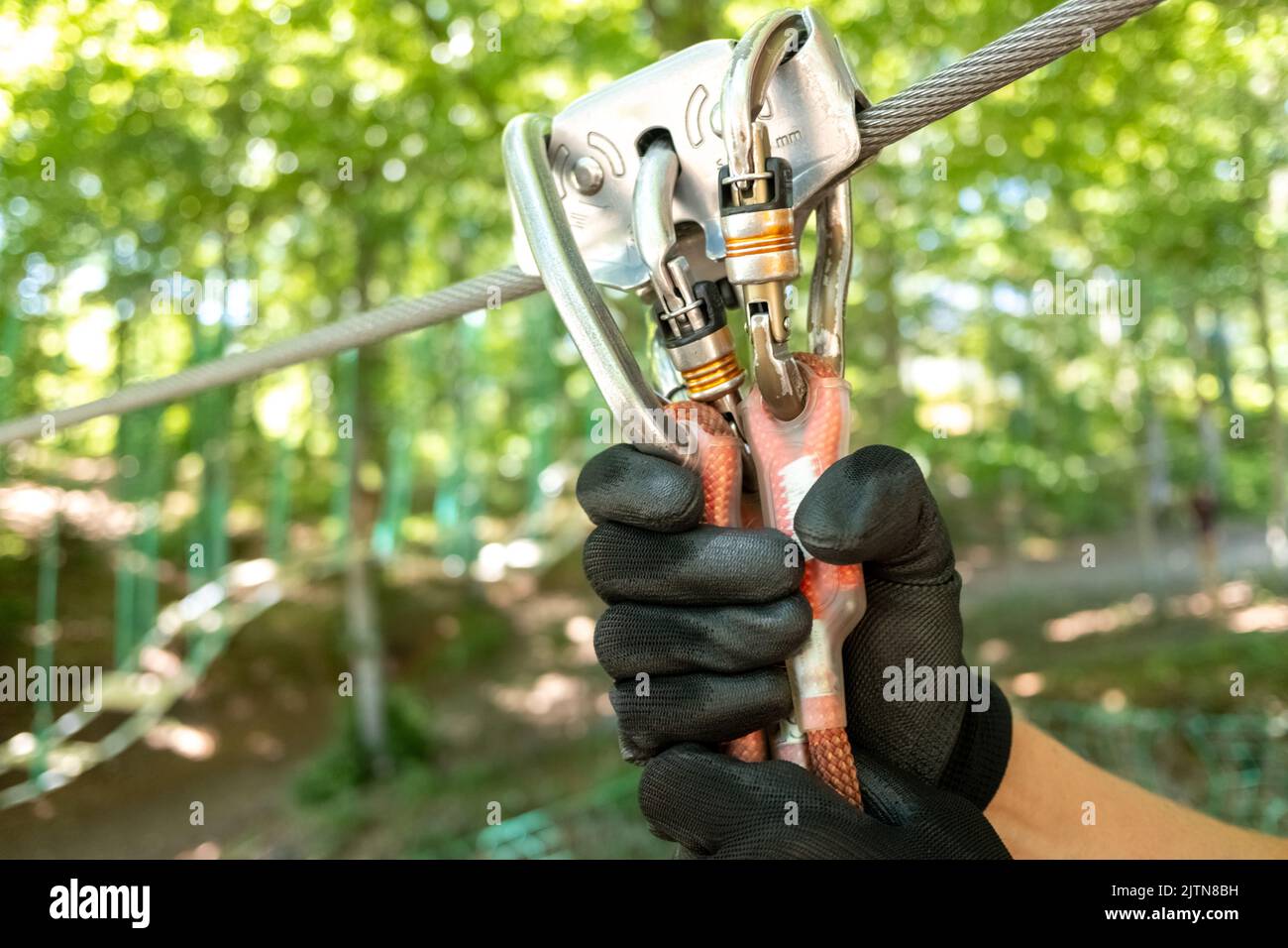 Heavy-duty zip line pulley and slider Stock Photo - Alamy