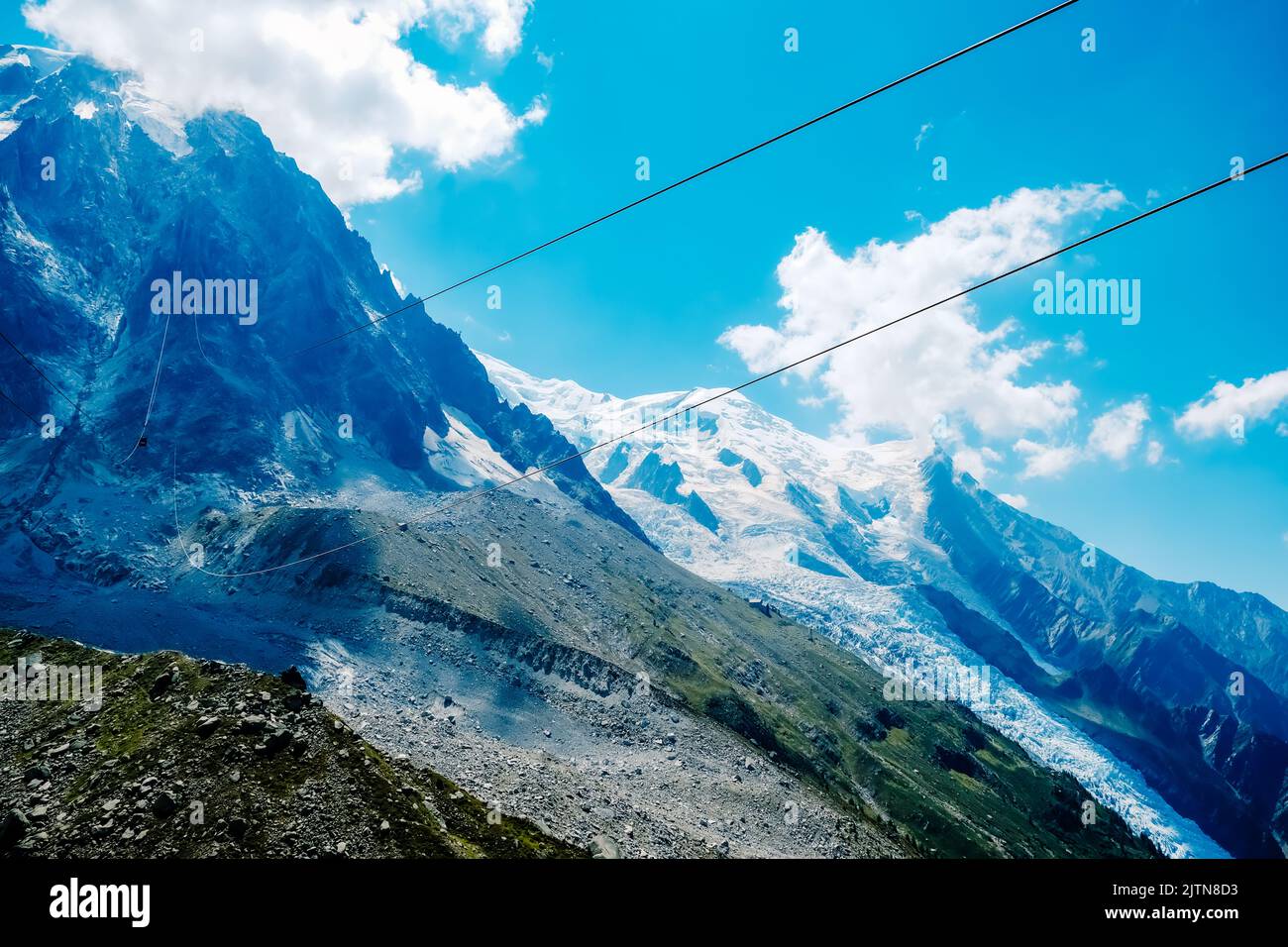 Cable cars criss-cross the alpine mountain landscape Stock Photo - Alamy