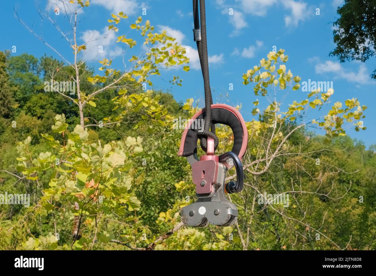 Heavy-duty zip line pulley and slider Stock Photo - Alamy