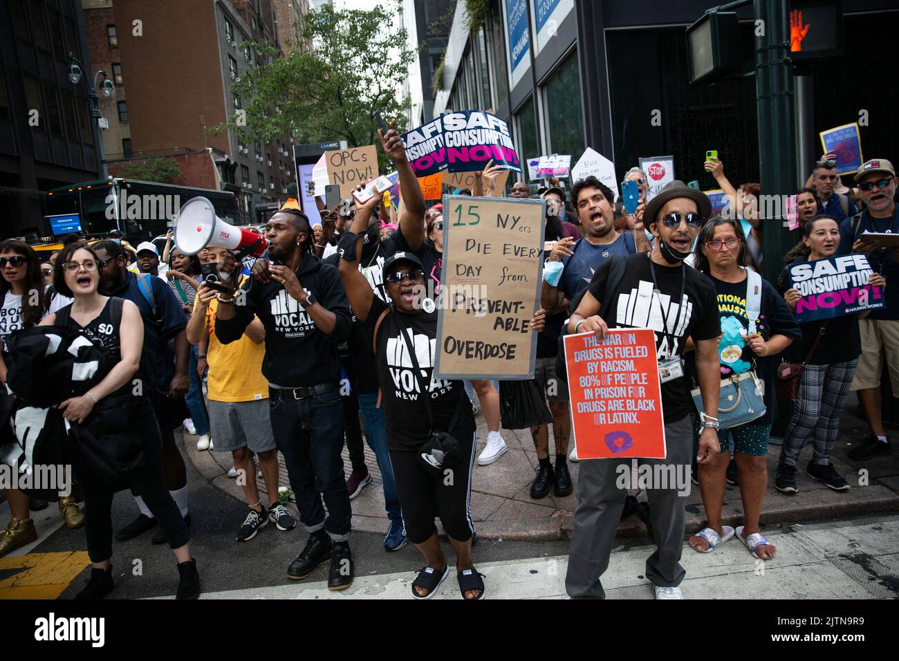 New York, United States. 31st Aug, 2022. Protesters hold signs and yell ...
