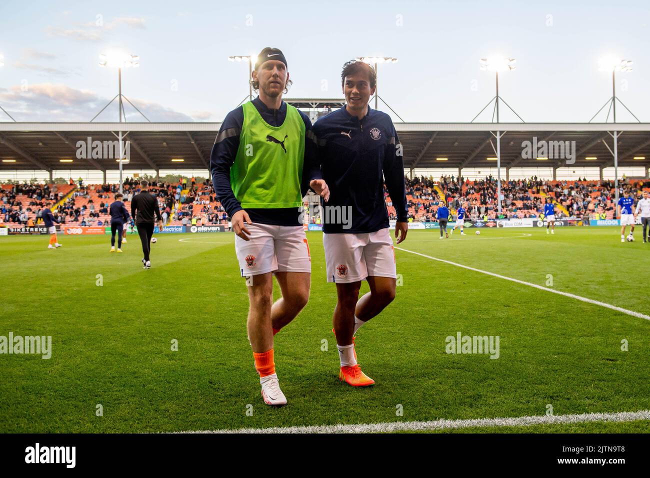 Josh Bowler #11 and Kenny Dougall #12 of Blackpool leave the field at ...