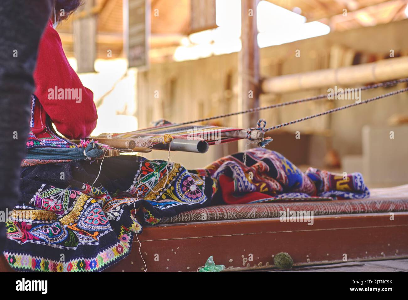 Indigenous woman showing traditional weaving technique and textile ...