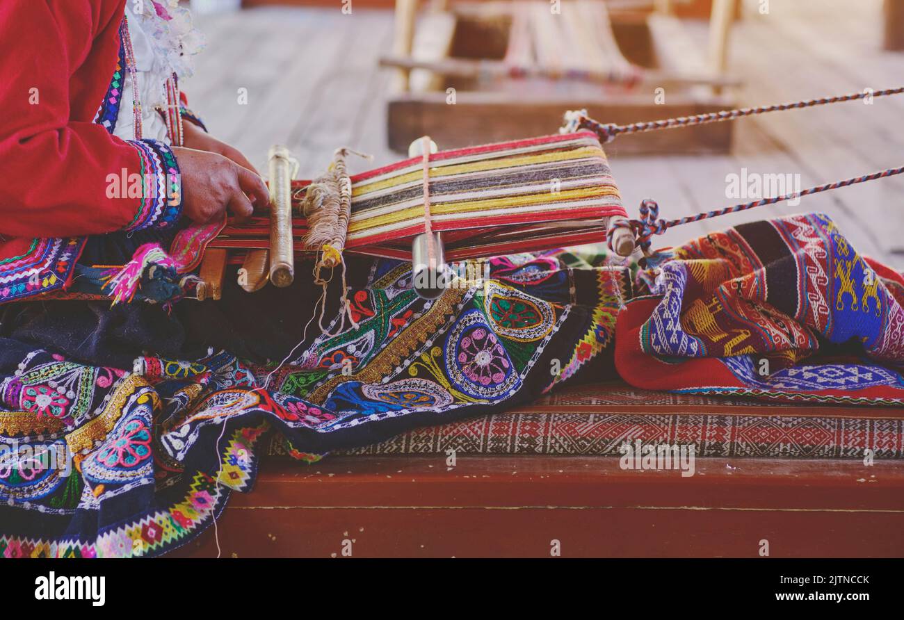 Indigenous woman showing traditional weaving technique and textile ...