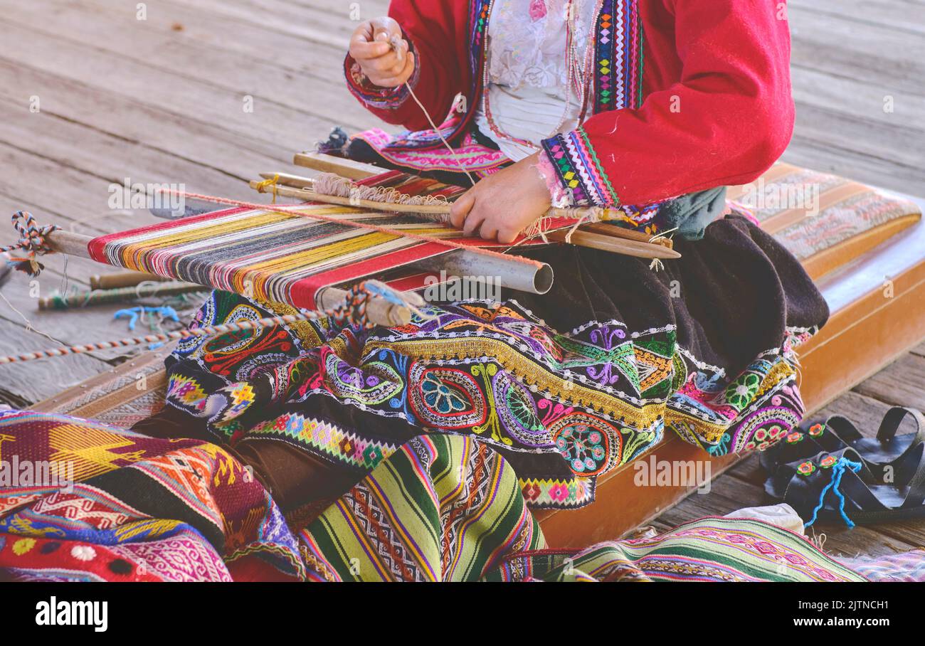 Indigenous woman showing traditional weaving technique and textile ...