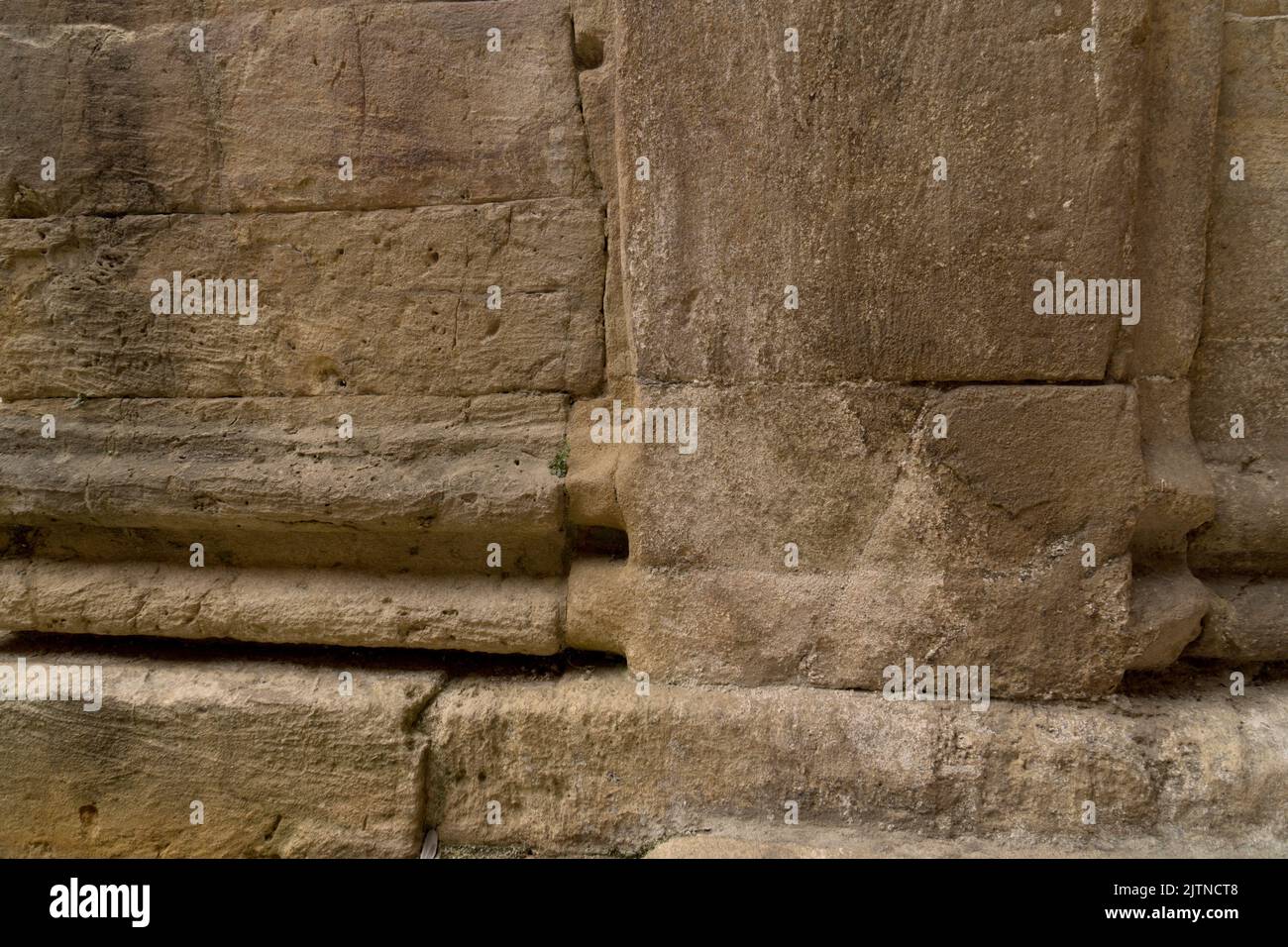 Detail close up of old antique stone block brick wall column with ...