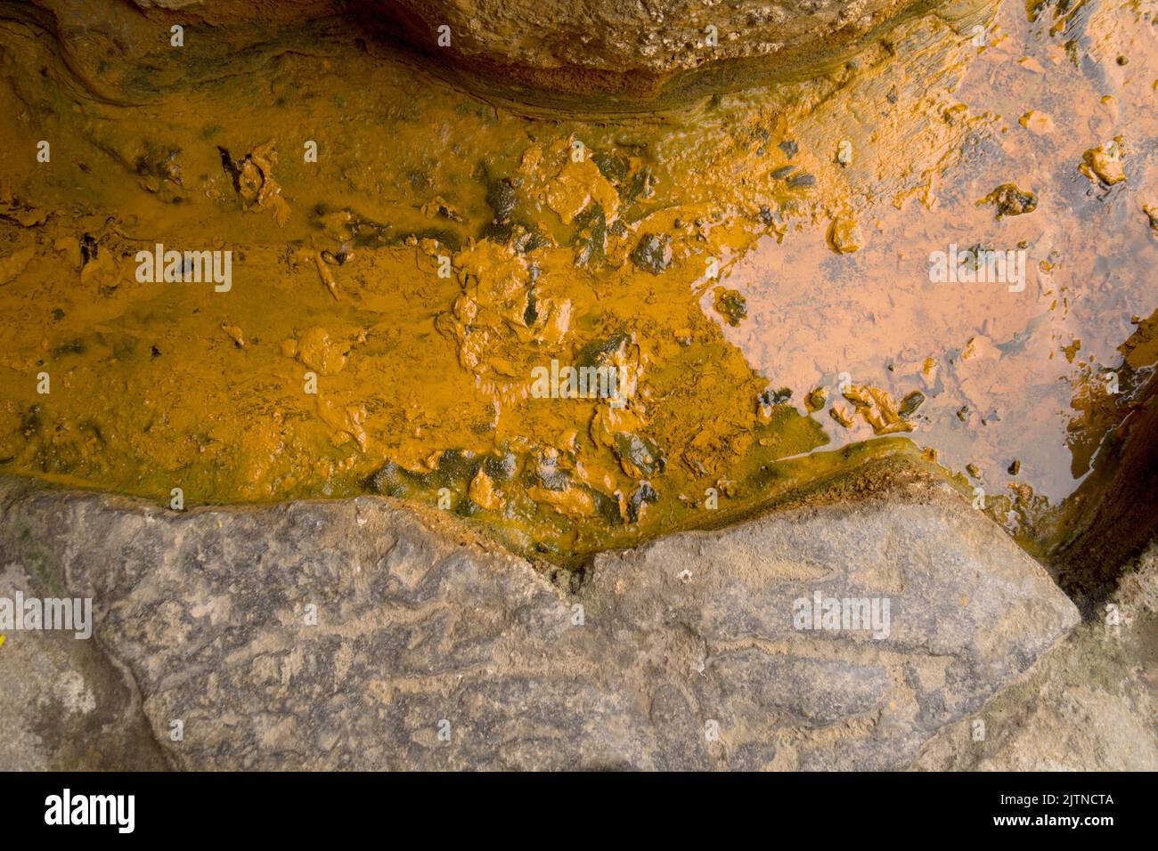 Detail close-up of the stone set drain of an ancient thermal geothermal ...