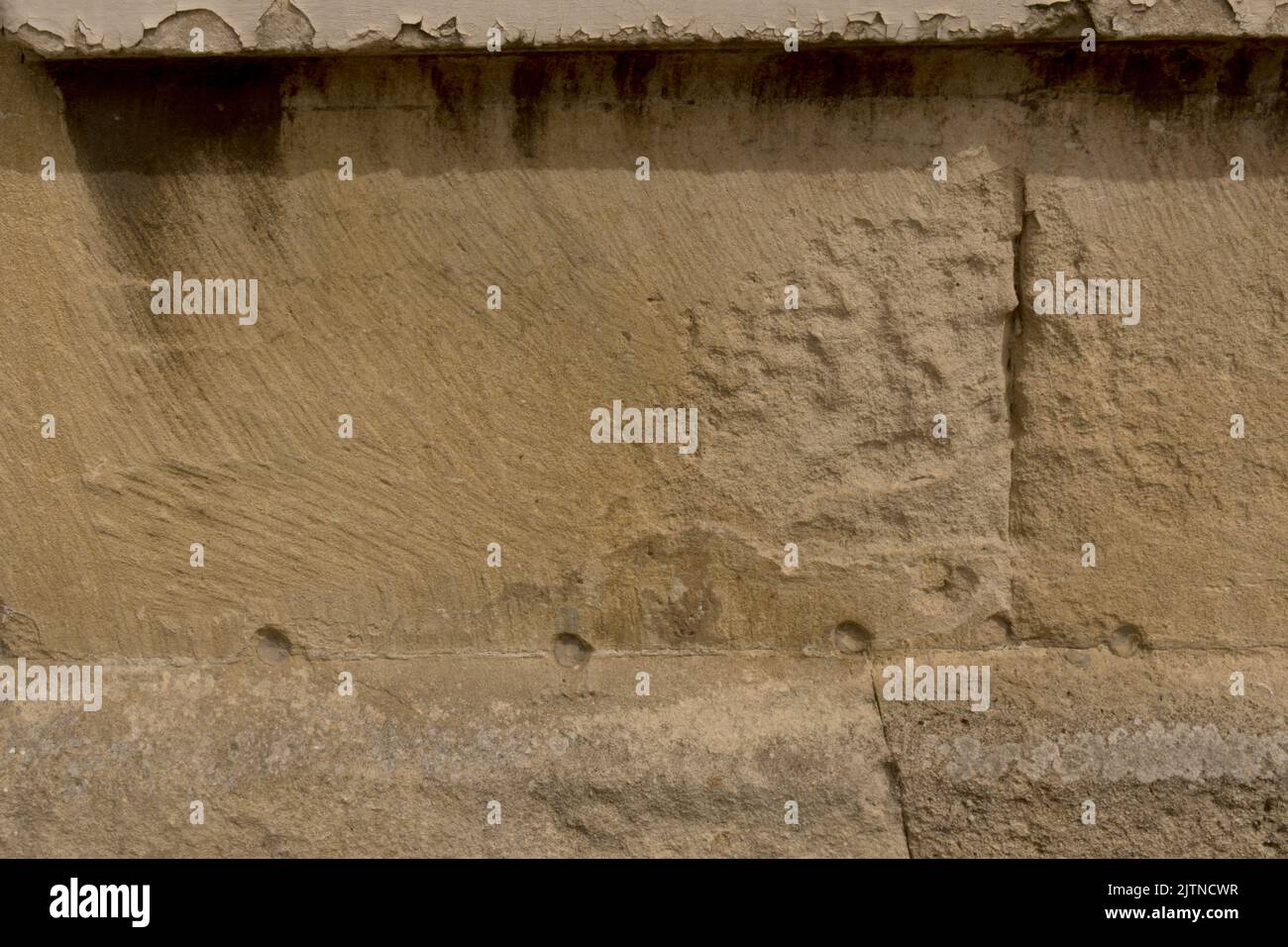 Detail close up of sandstone blocks of historical old antique wall with ...