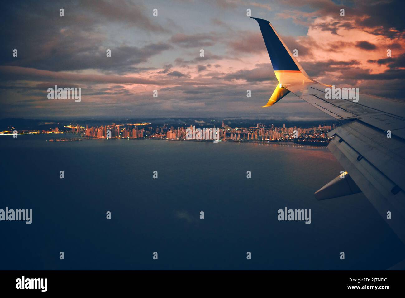 View from the airplane window on a beautiful sunset and clouds of ...