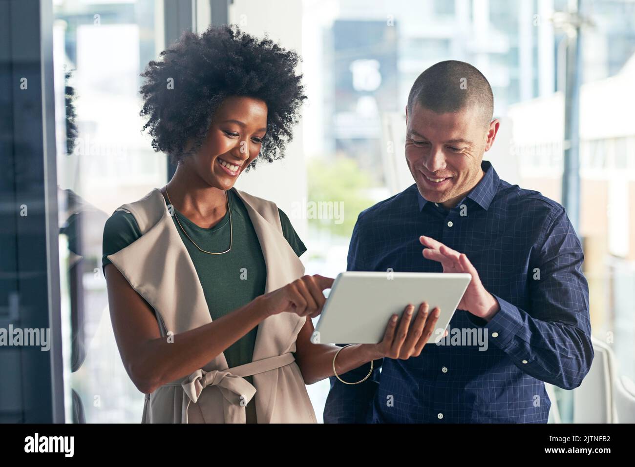 Coming together equals the best results. two colleagues discussing ...