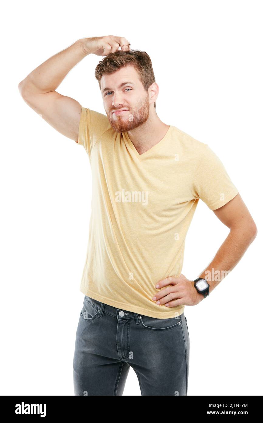 Properly puzzled. Studio portrait of a young man scratching his head in ...