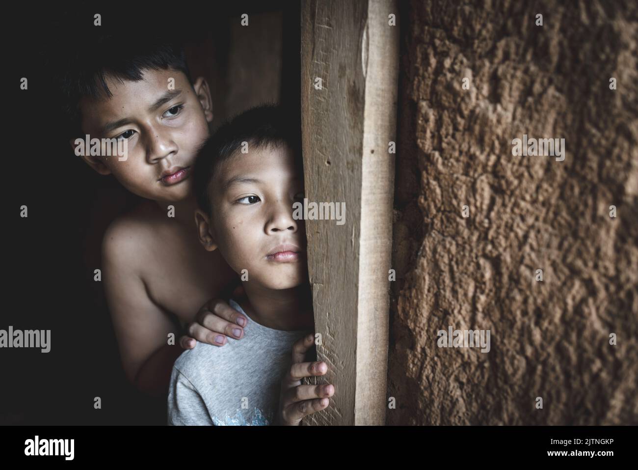 Two poor children Secretly beside the door, his eyes were sad and ...