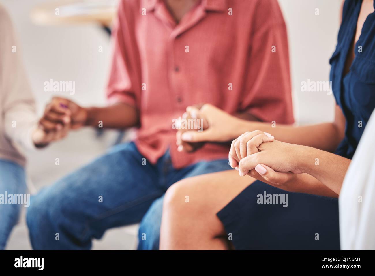 Praying, faith and belief in support group, business people holding hands in meeting and giving ...