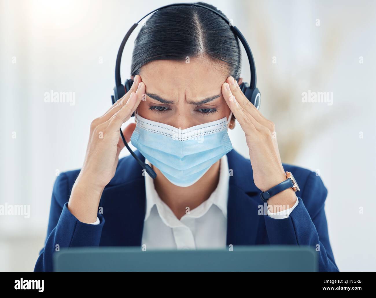Burnout, headache and pain call center agent working on laptop, headset ...