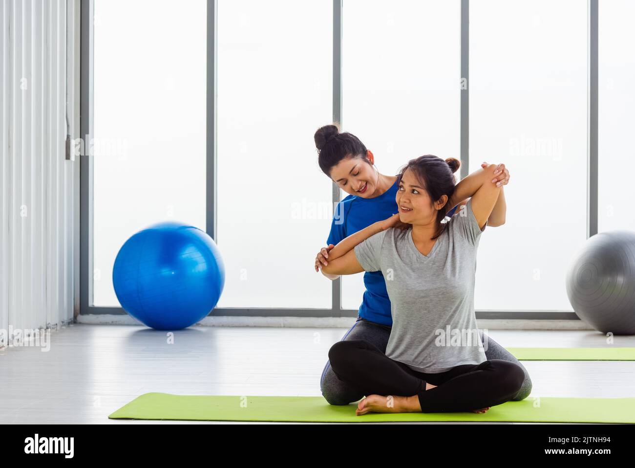 Woman teaching boat pose exercise hi-res stock photography and images ...