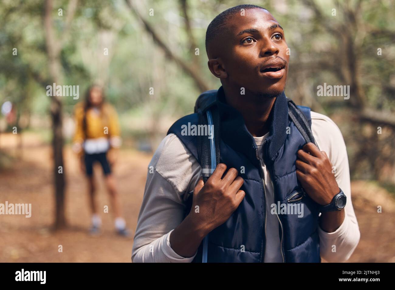 Hiking young black man in forest nature with wow face traveling with ...