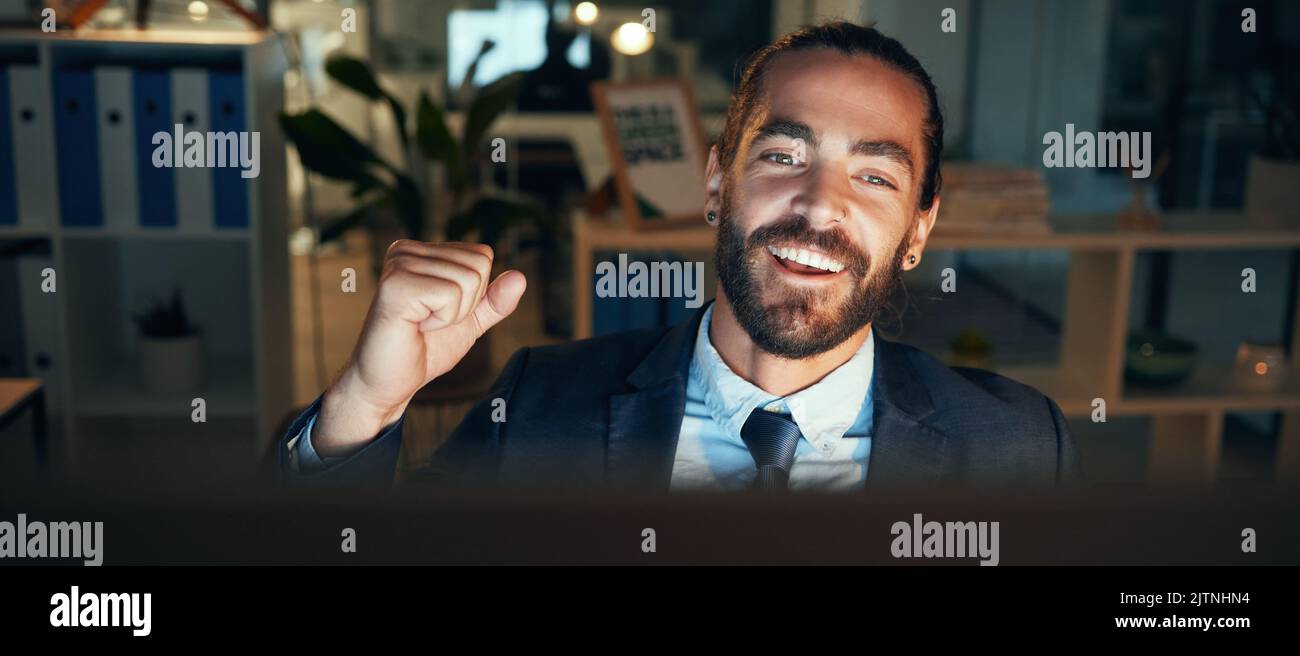 Night business man fist celebrate for success, winning and bonus ...