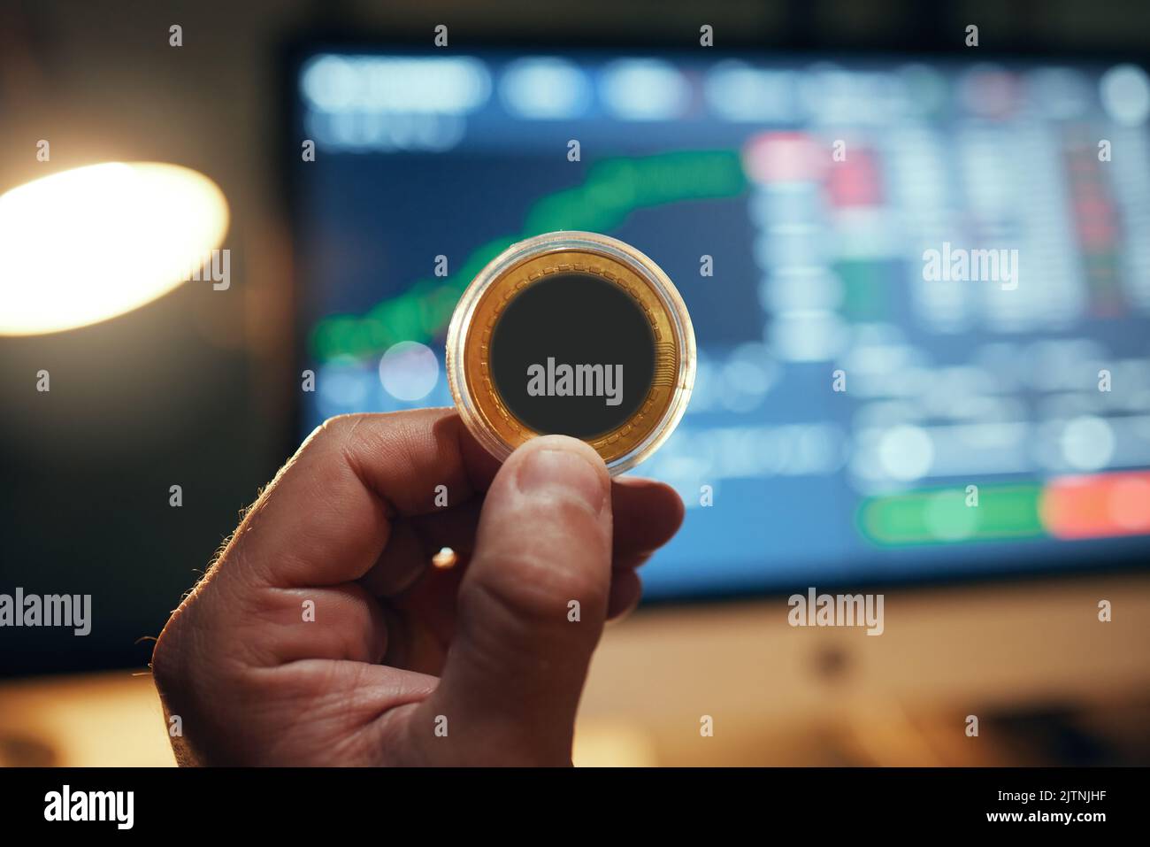 Crypto trade, investment and hand with coin in front of online trading ...