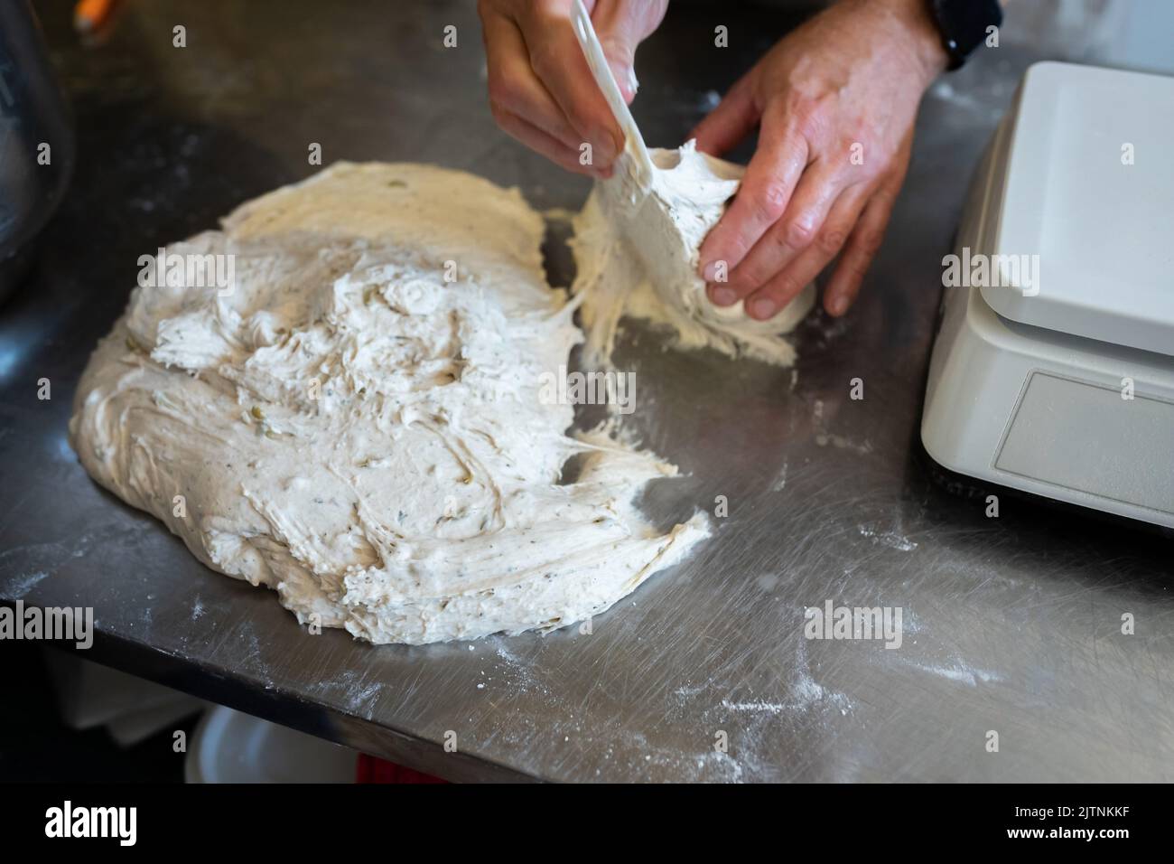 The process of making bread. Dividing the wheat dough into pieces ... The process of making bread. Dividing the wheat dough into pieces ...