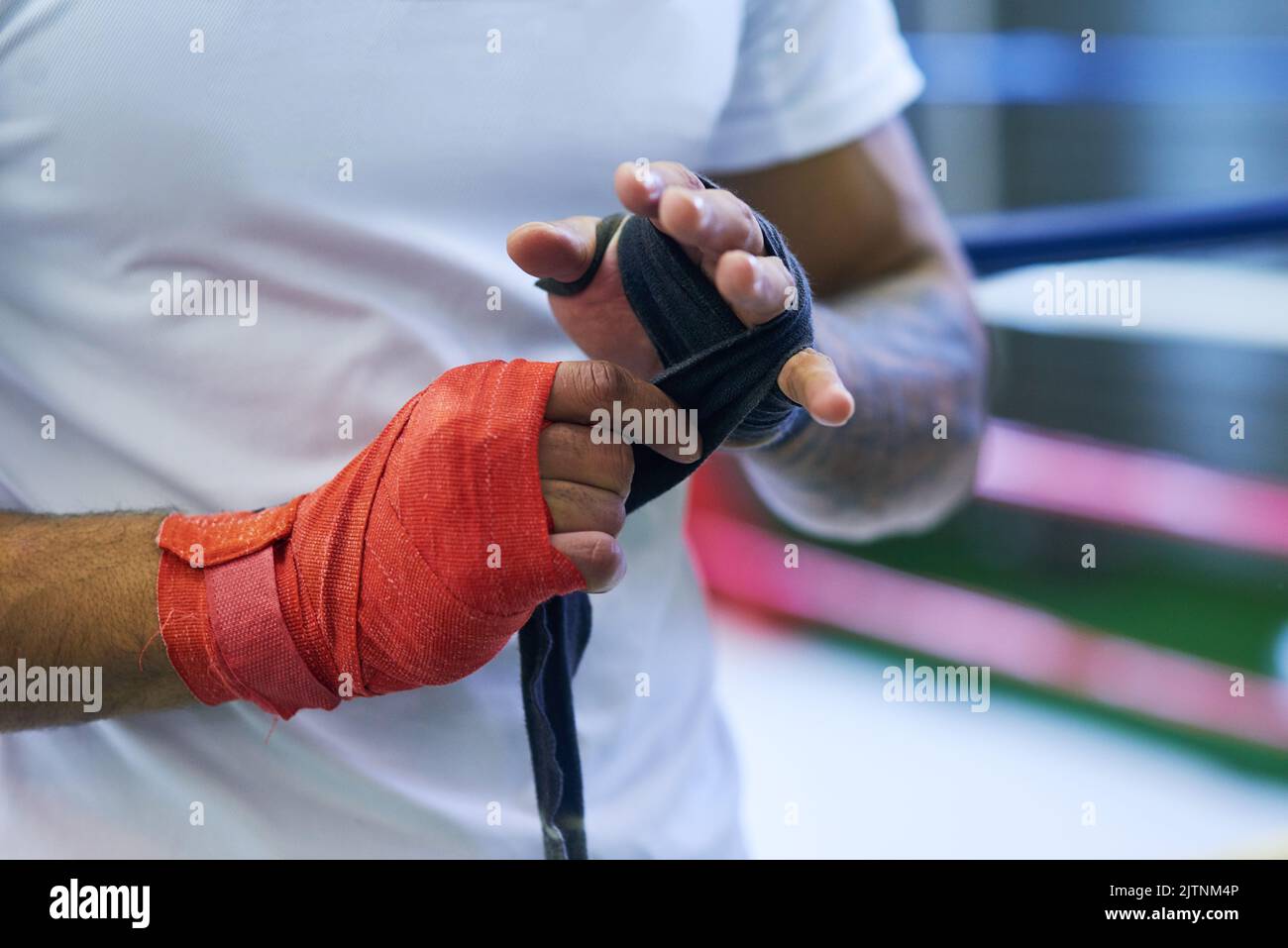 Protect your hands and wrists. an unrecognizable man strapping his ...