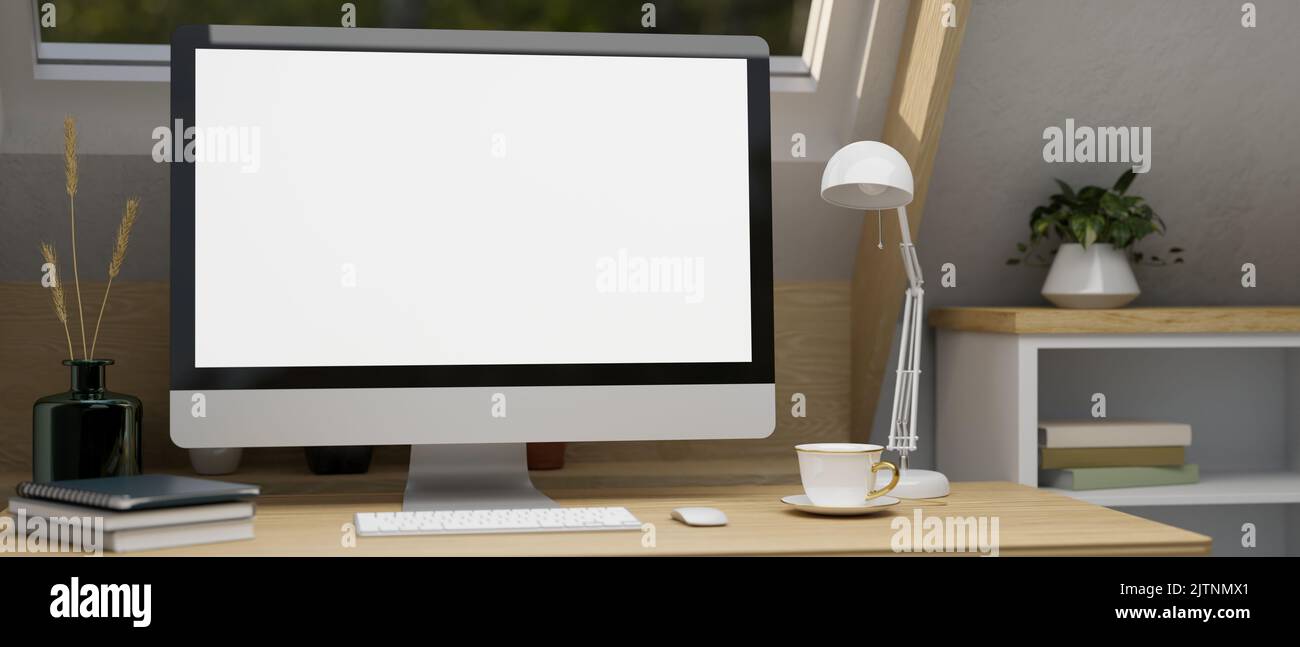close-up shot of a minimal comfortable home workspace with pc desktop ...