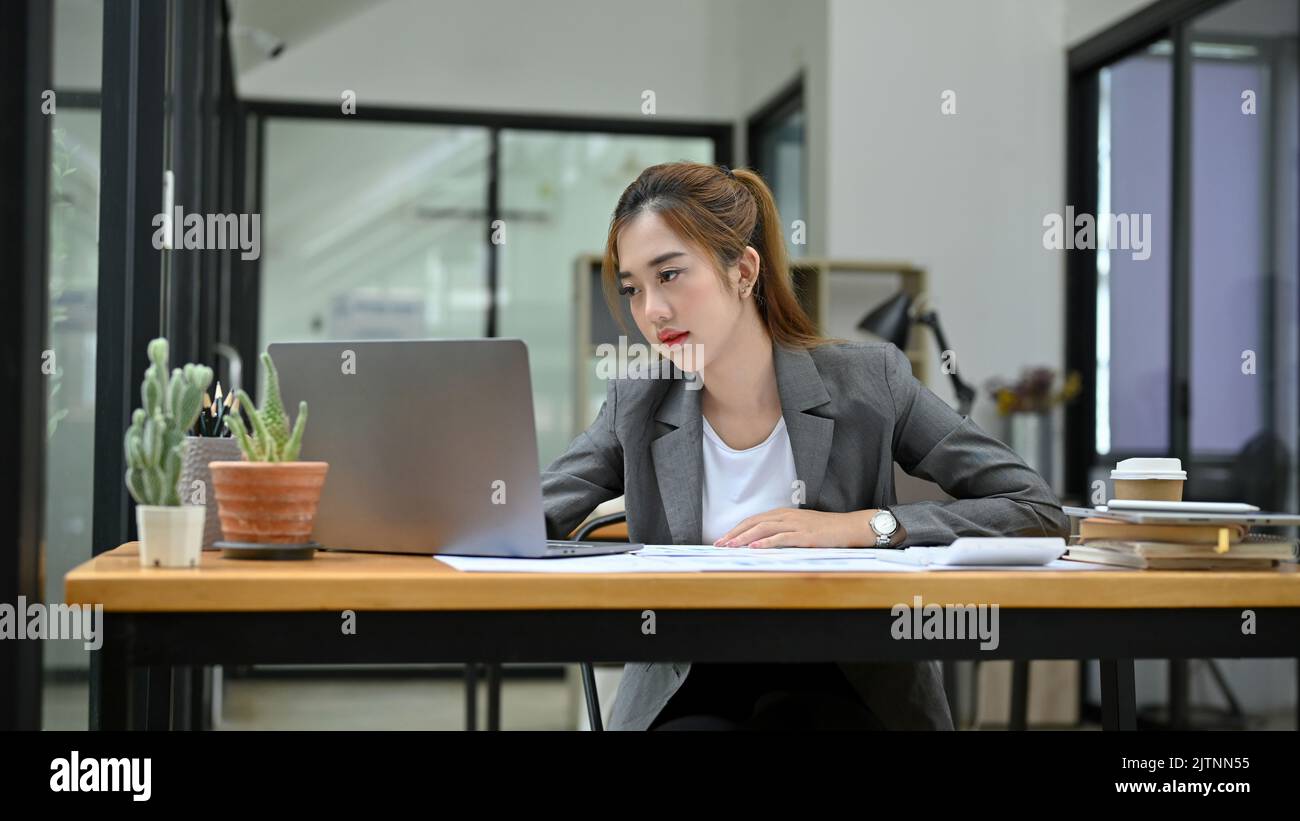 Woman concentrating on project hi-res stock photography and images - Alamy
