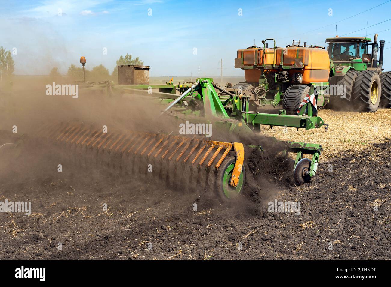 Tractor cultivating plowing agriculture hi-res stock photography and ...