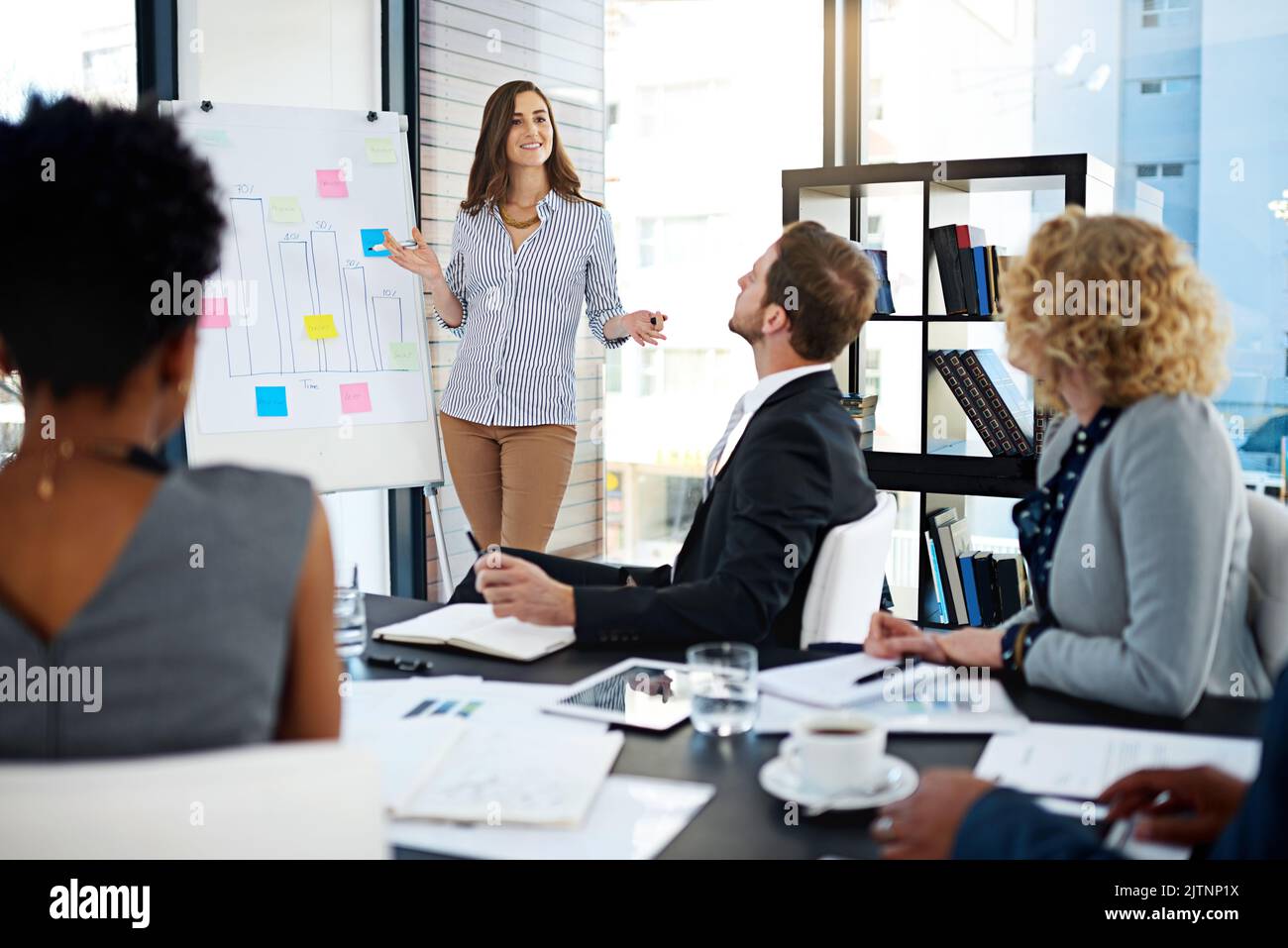 Lets take a look at the numbers. a young businesswoman giving a ...