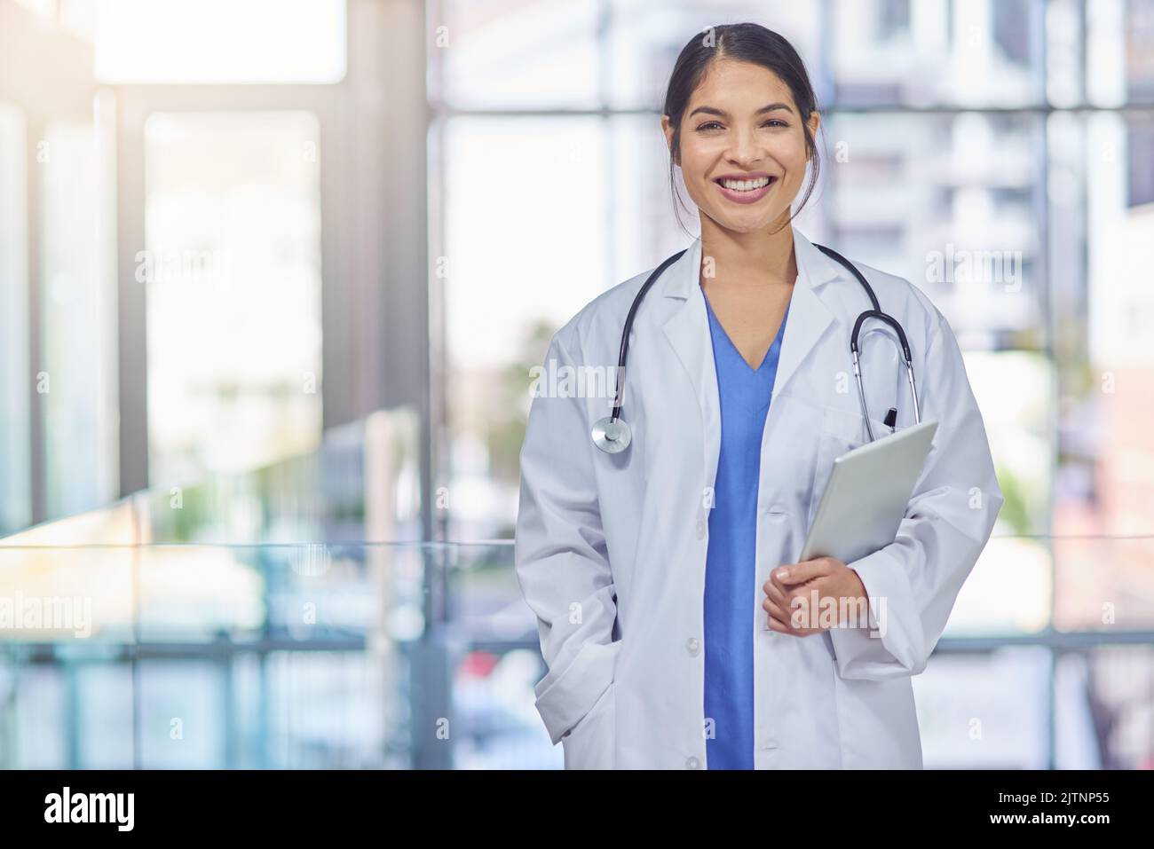 Let me help you reach complete health again. Portrait of a young doctor ...