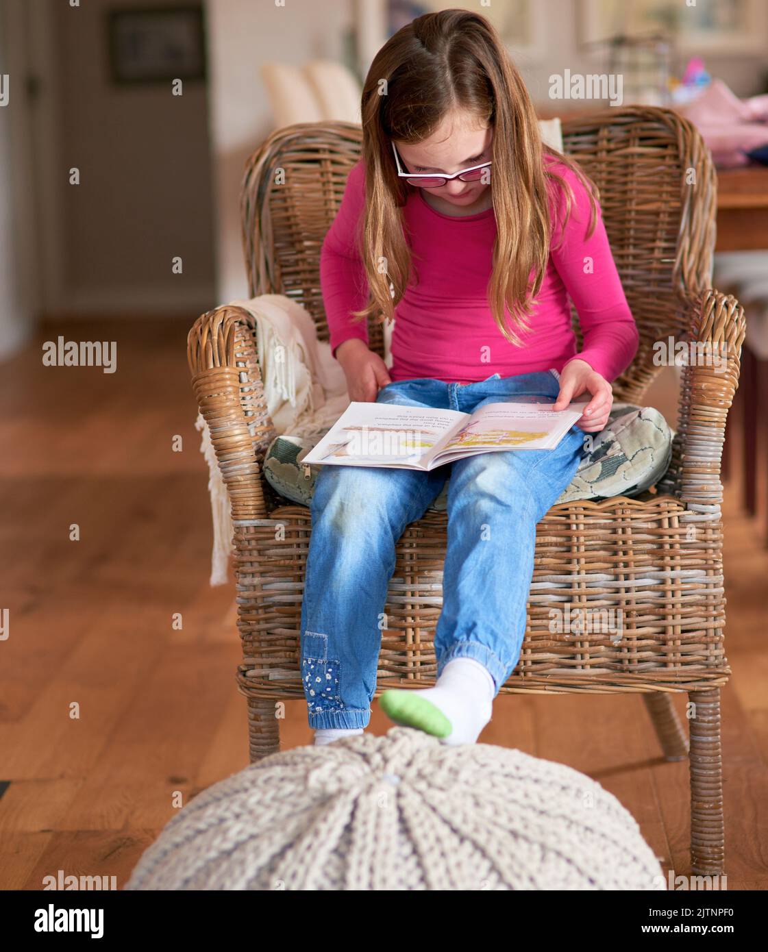 Shes quite the little bookworm. a little girl reading a book on her own ...