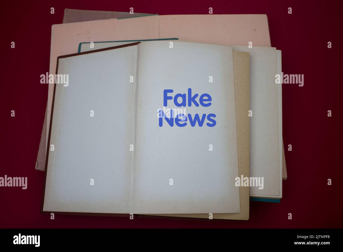 Fake News word in opened book with vintage, natural patterns old ...