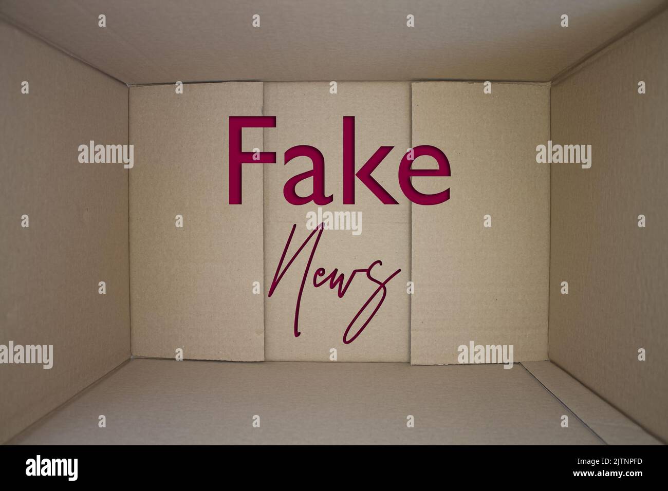 Fake News word with cardboard box. Brown folded cardbox Stock Photo - Alamy