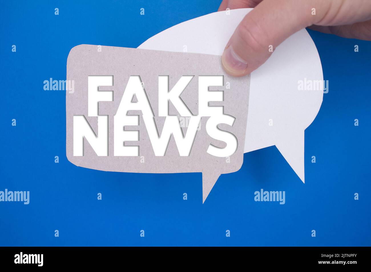 Speech bubble in front of colored background with Fake News text Stock ...