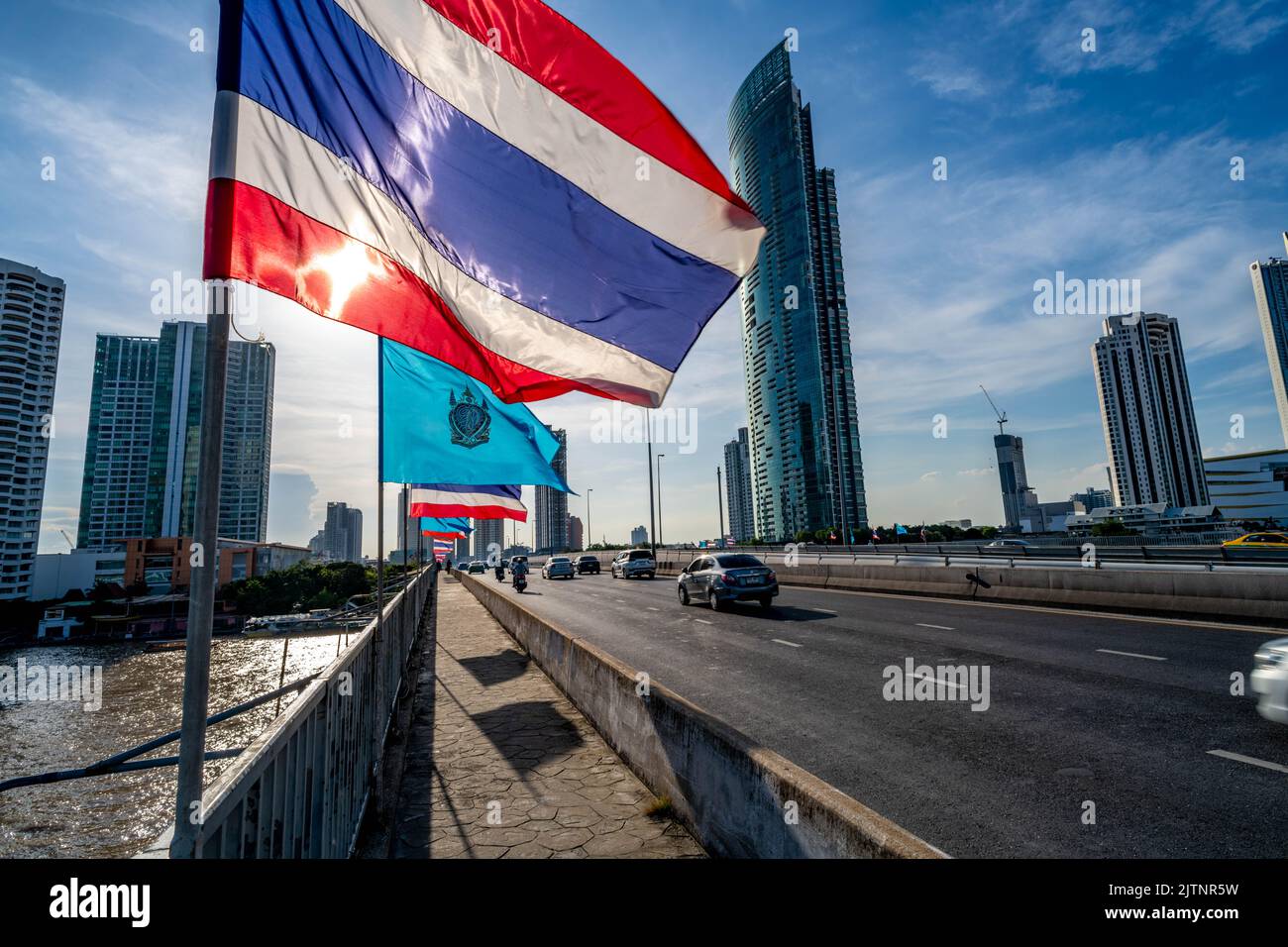 Flags on the Taksin Bridge over the Chao Phraya River in Bangkok Stock ...