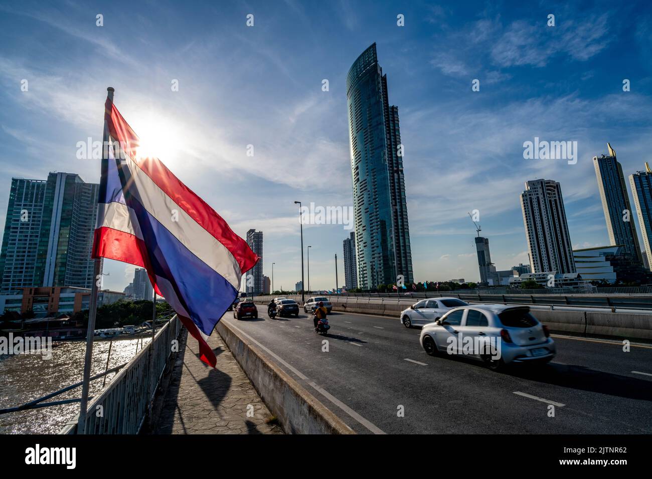 Flags on the Taksin Bridge over the Chao Phraya River in Bangkok Stock ...