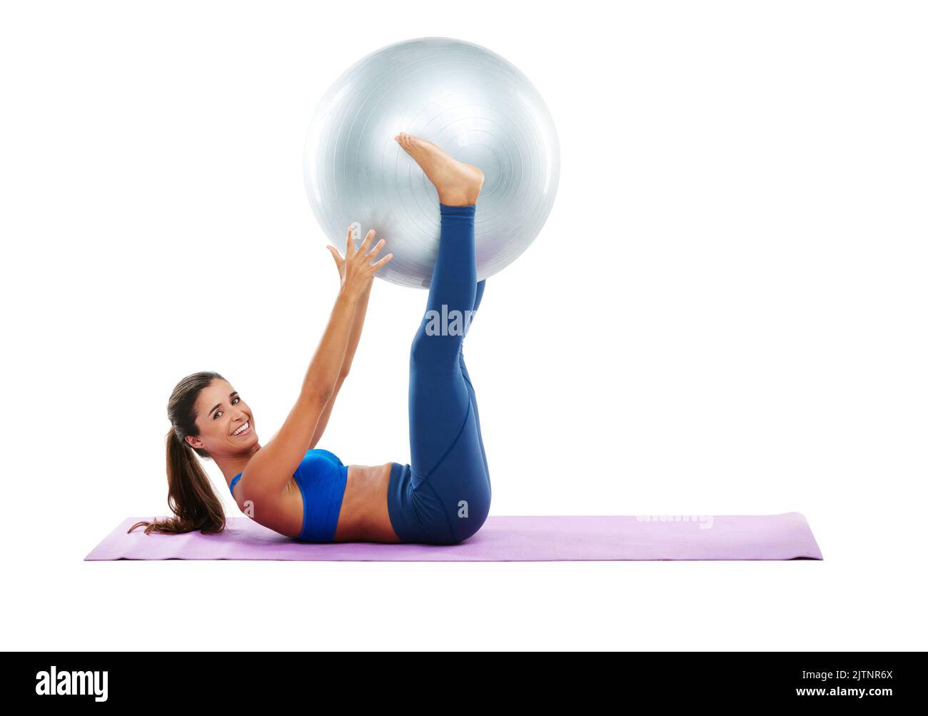 Reaching for higher fitness levels. Portrait of a sporty young woman ...