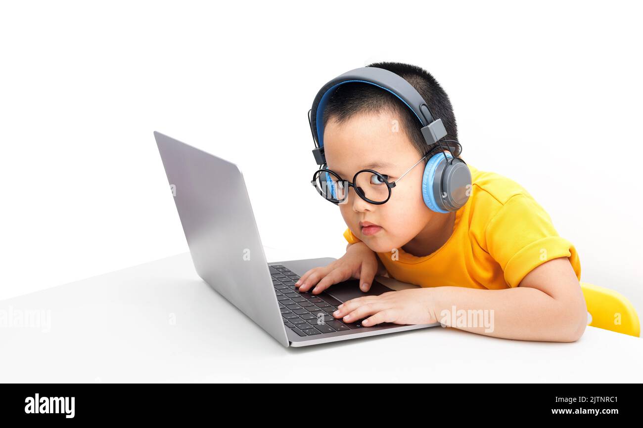 Little boy in a yellow t-shirt working on the Internet. isolated on ...