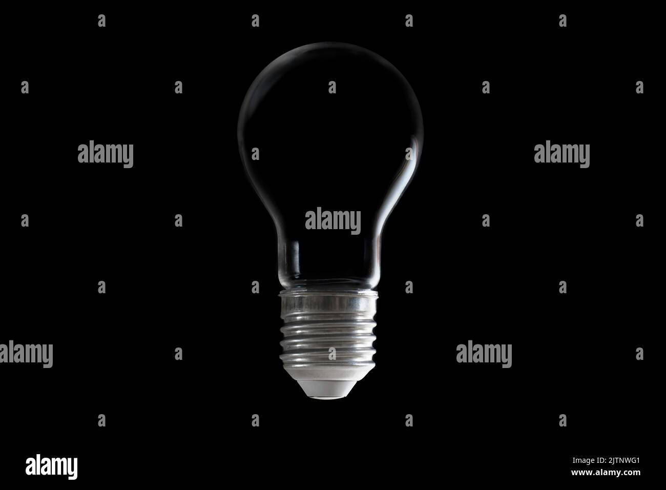Incandescent light bulb with no filament inside isolated on black ...