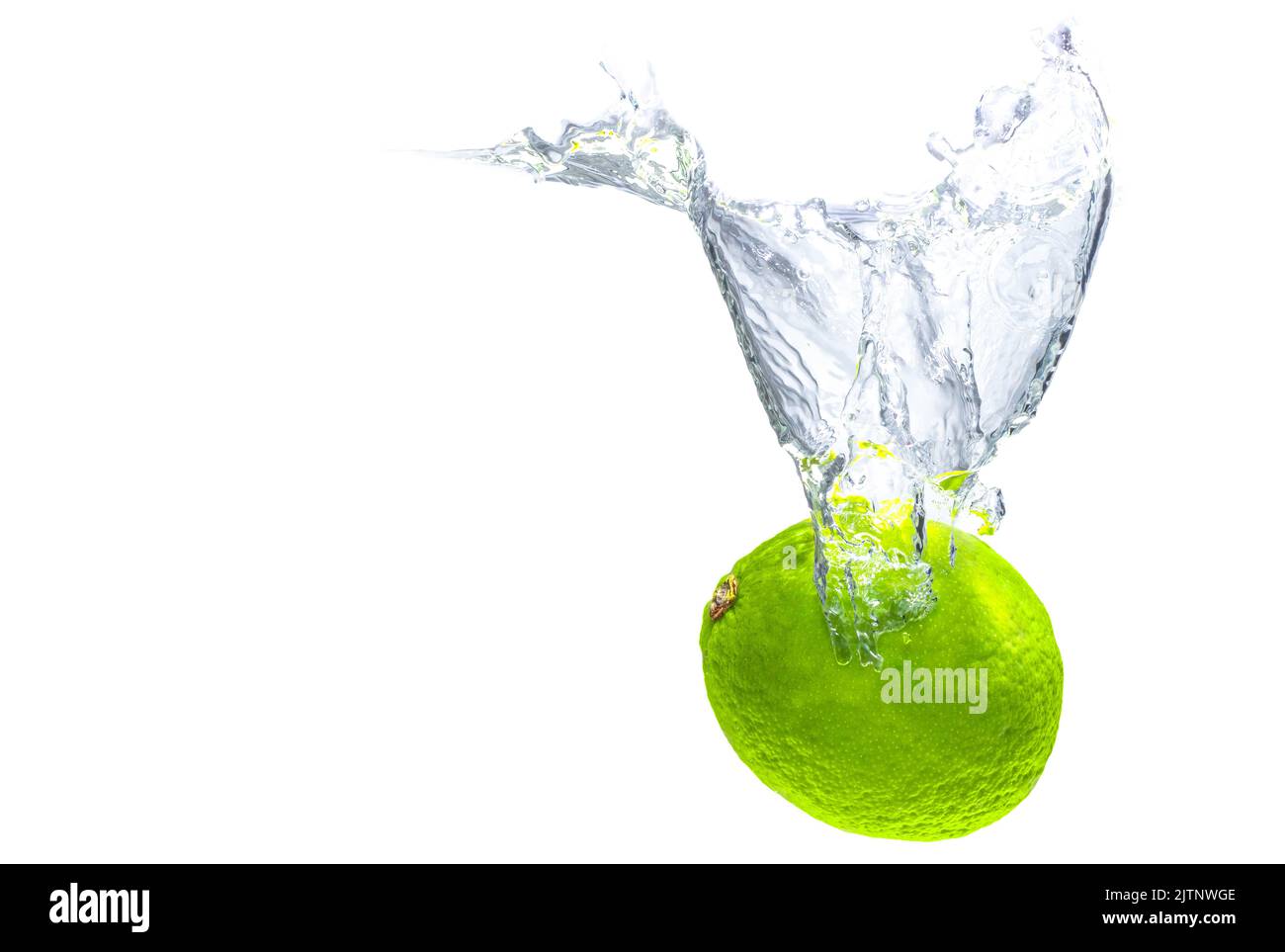 Whole lime falling underwater with splashes isolated on white ...