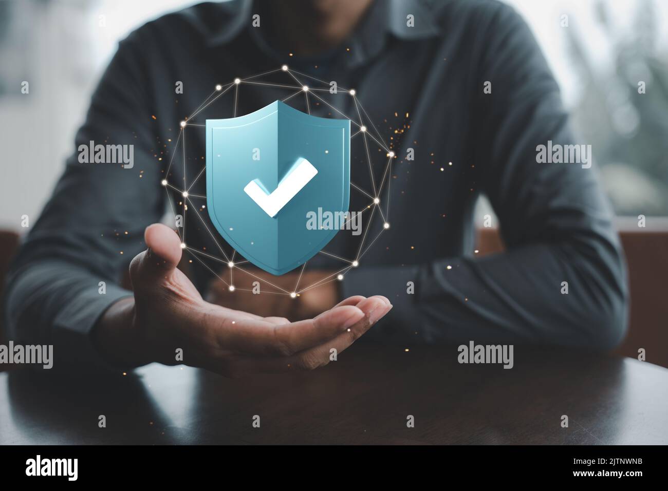 Businessman holding 3D digital shield protection with tick check mark ...